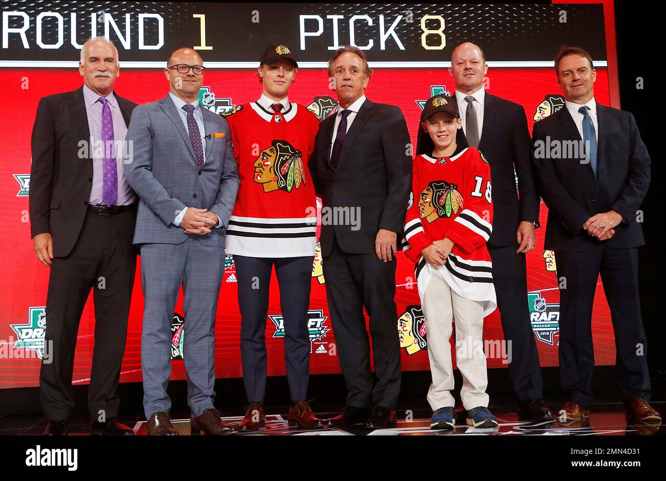 Adam Boqvist, third from left, of Sweden, poses after being selected by ...