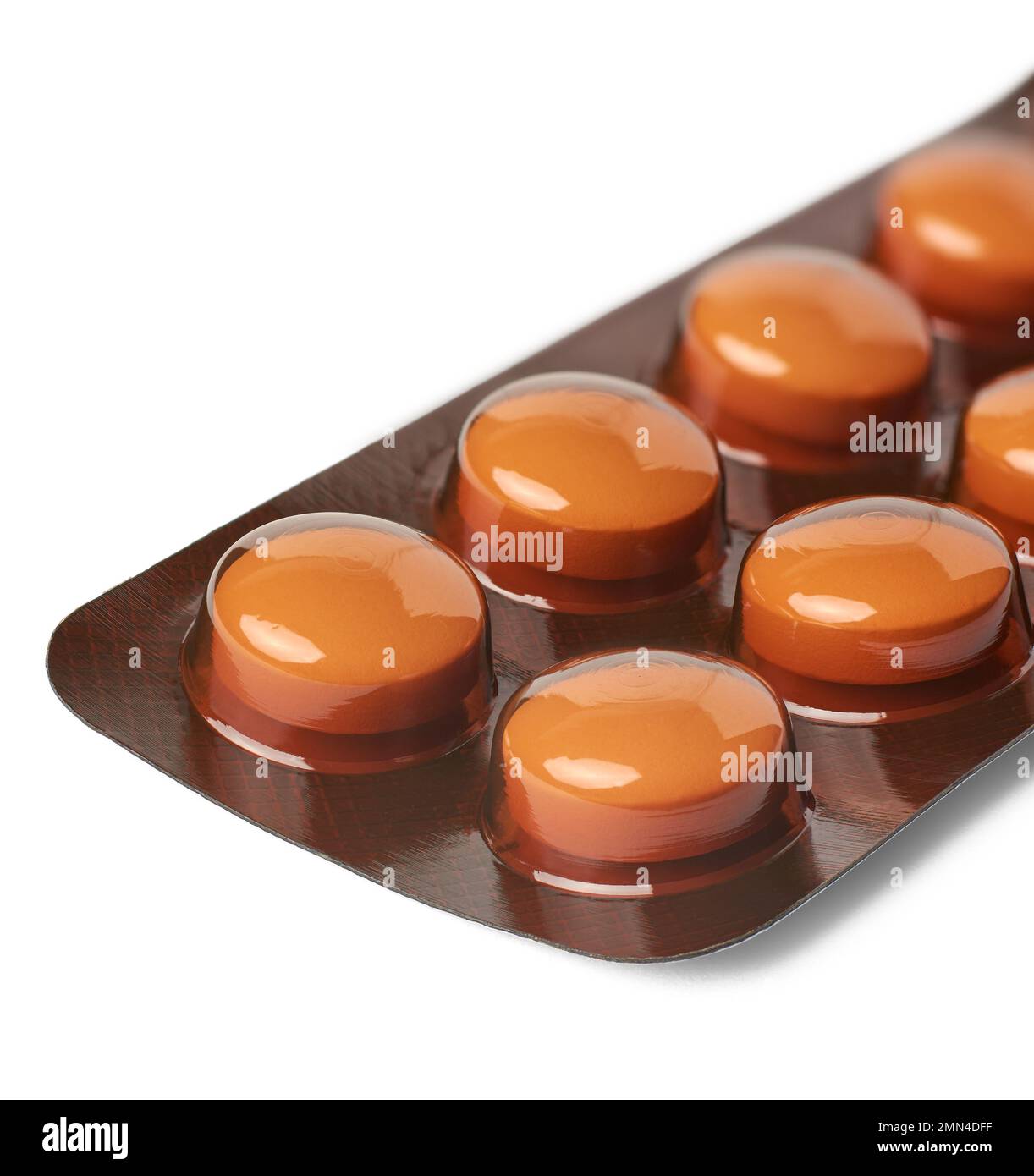 close-up of orange color tablets in blister pack, medical drug package ...