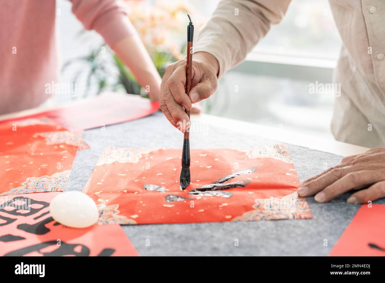 Happy father and son at home to write calligraphy Stock Photo - Alamy