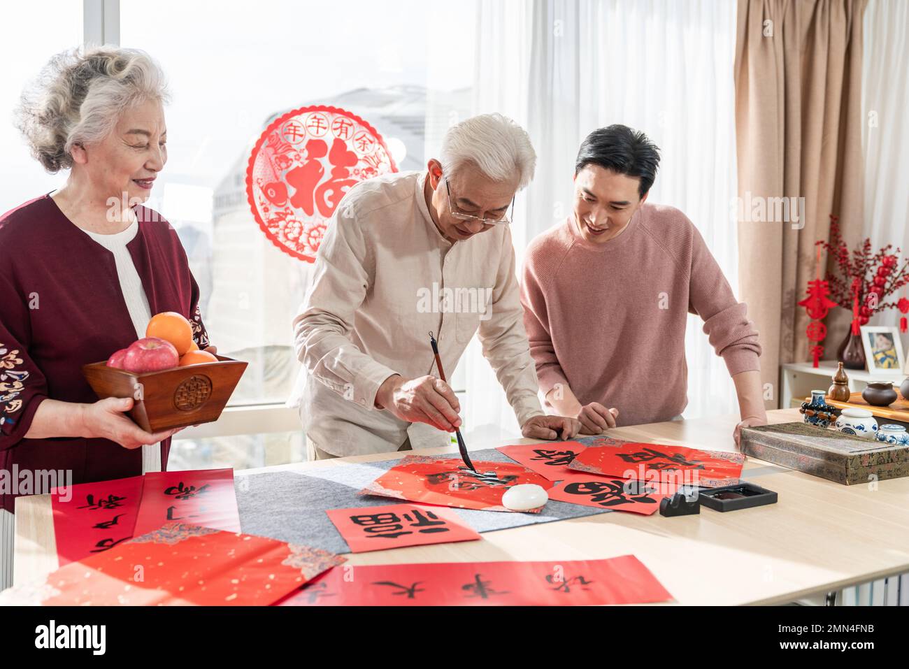 Three adults people writing hi-res stock photography and images - Alamy