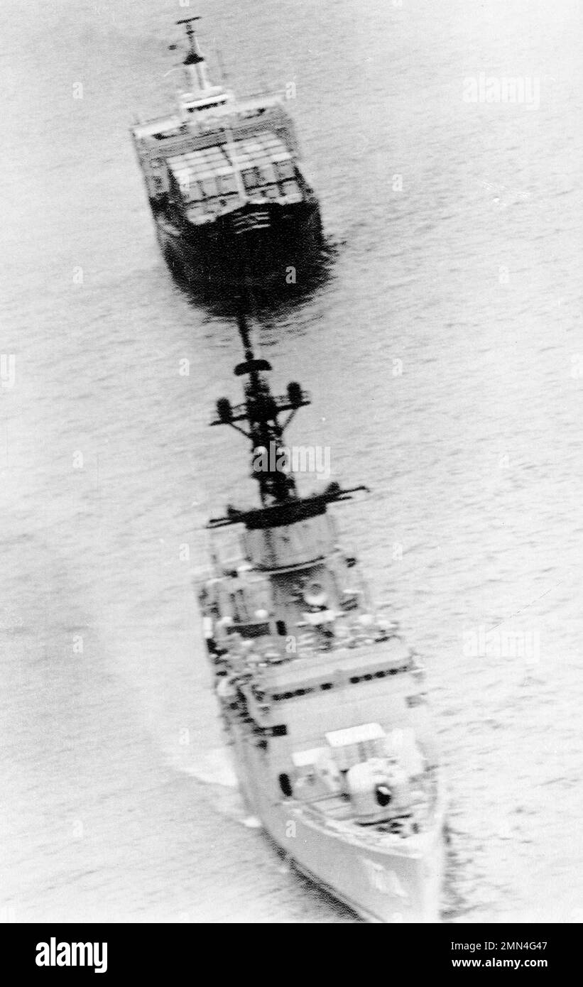 The U.S. merchant ship SS Mayaguez, rear, is towed away from Koh Tang ...