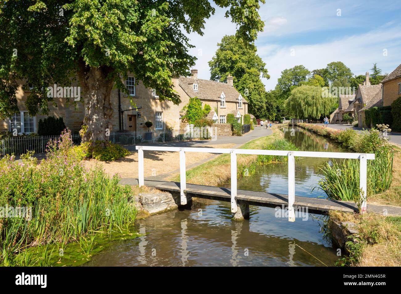 Footbridge over the River Eye, Lower Slaughter, Gloucestershire, UK ...