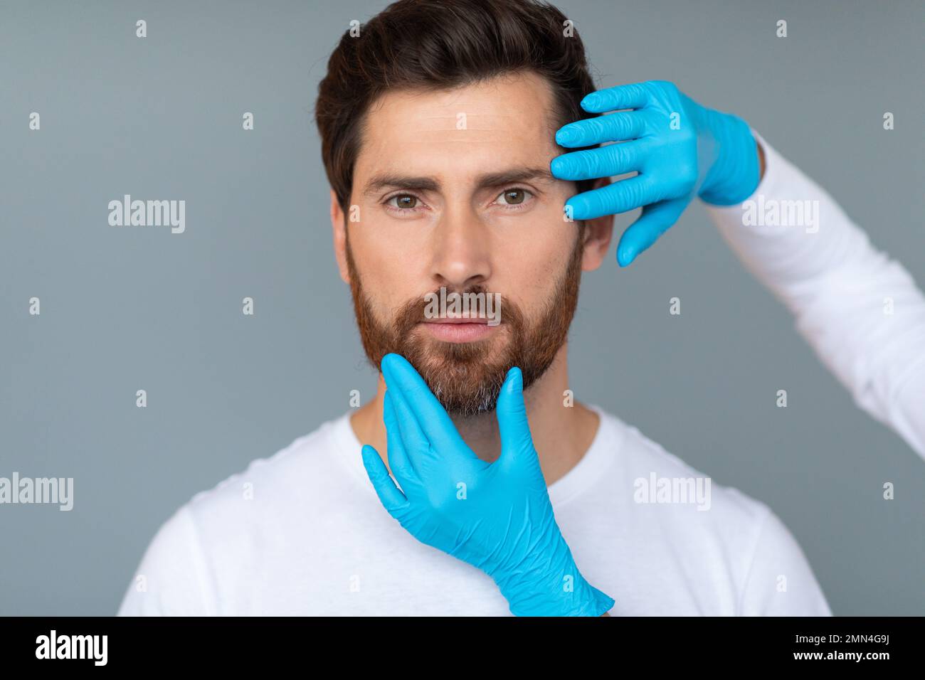 Plastic surgery and aesthetic cosmetology concept. Cosmetician hands in ...