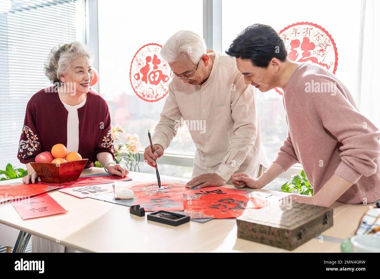 Three adults people writing hi-res stock photography and images - Alamy