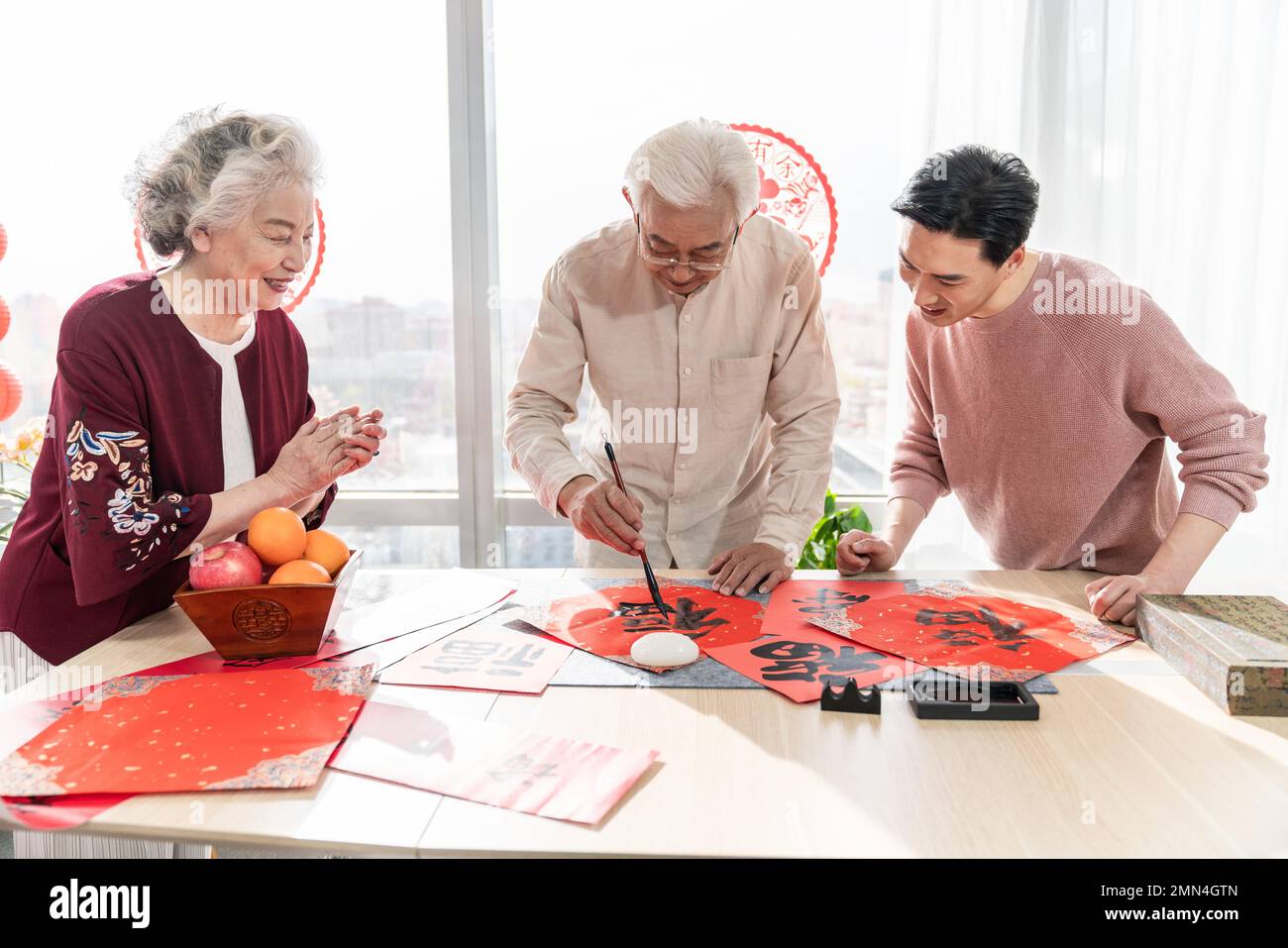 Three adults people writing hi-res stock photography and images - Alamy