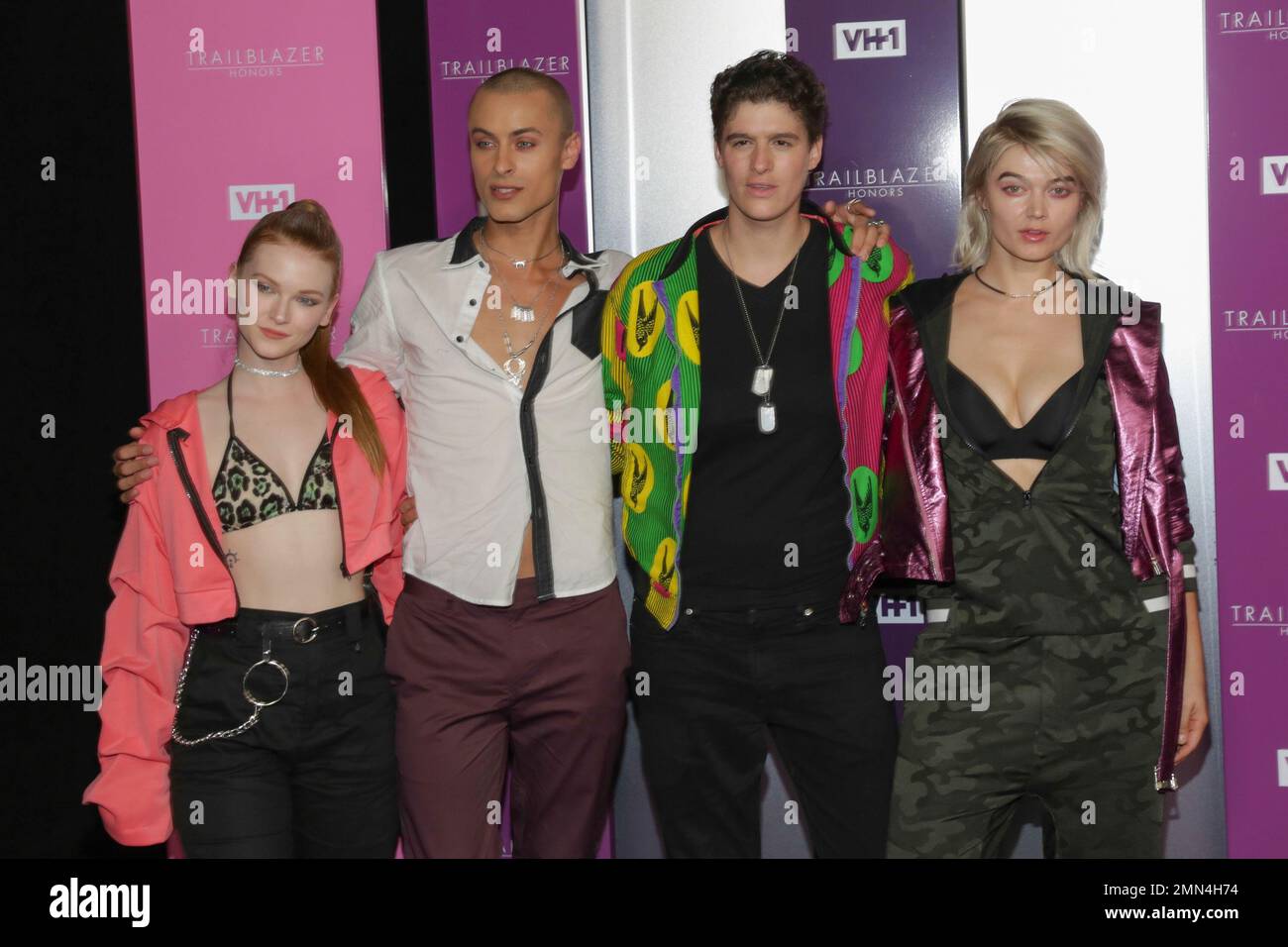 Cory Wade, 2nd from left, Rain Dove, 3rd from left, and guests attend ...