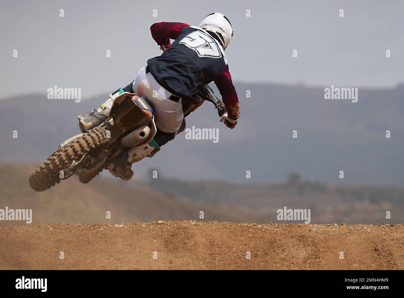 Rider driving in the motocross race the rear wheel motocross bike Stock ...
