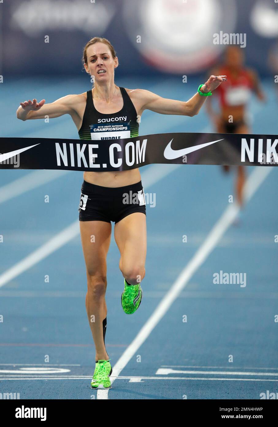 Molly Huddle crosses the finish line as she win the women's 10,000 ...