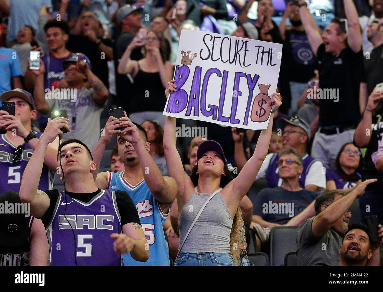 Sacramento Kings fan Brianna Mallari, right, celebrates after the Kings ...