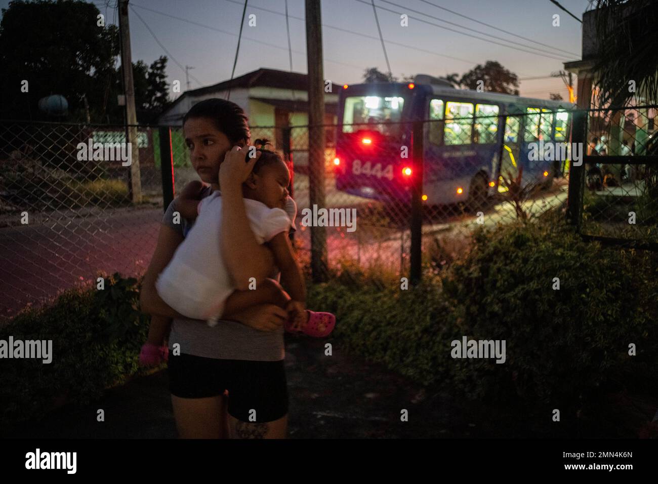 Melanie Rolo Gonzalez holds her daughter Madisson in their home's ...