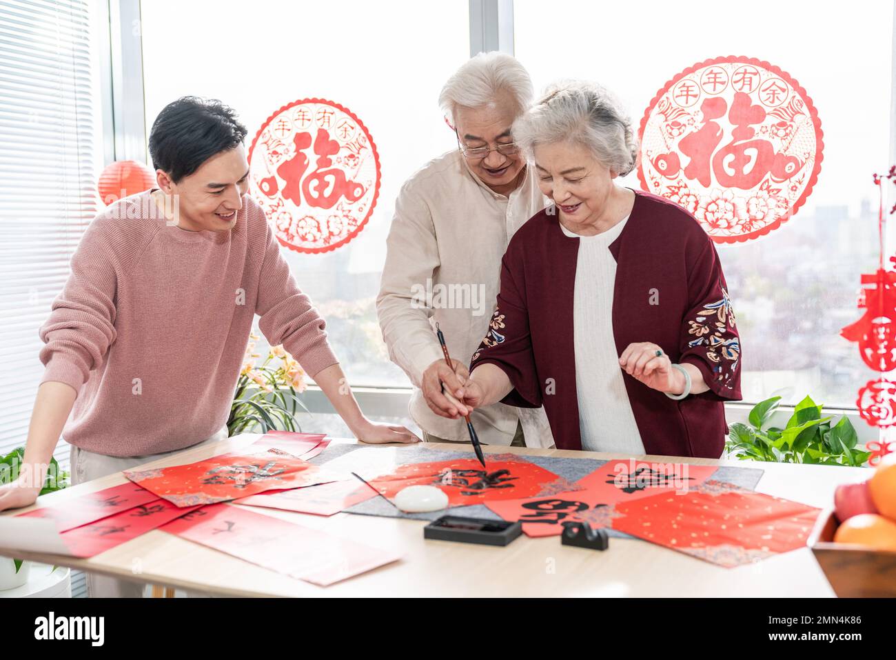 Happy three writing brush calligraphy at home Stock Photo - Alamy