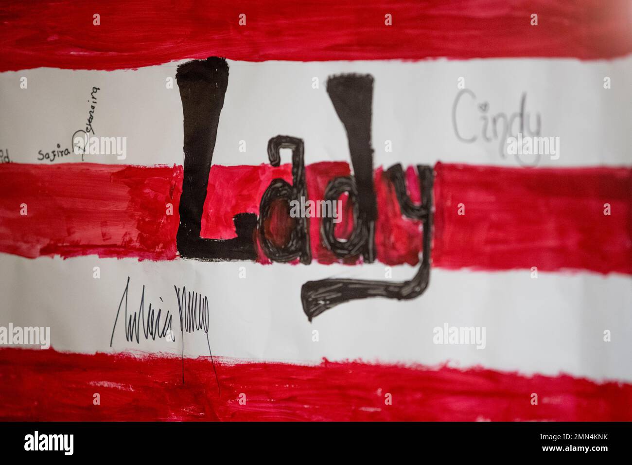 The signature of first lady Melania Trump signs on American flag ...