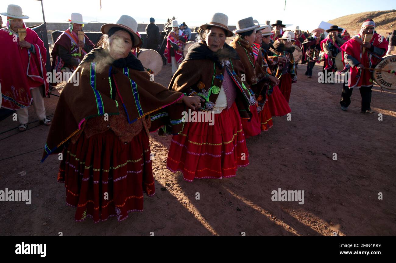 Aymara indigenous women dance after receiving the first rays of ...