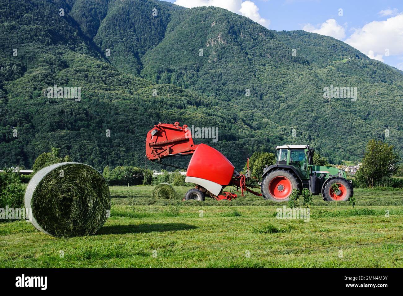 Agricultural tractor hay baler hi-res stock photography and images - Alamy