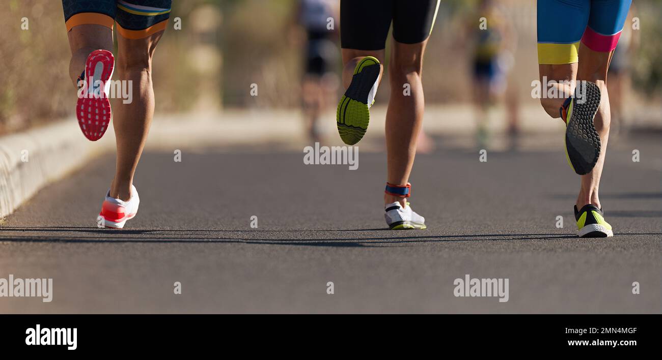 Marathon running race, people feet on city road Stock Photo - Alamy