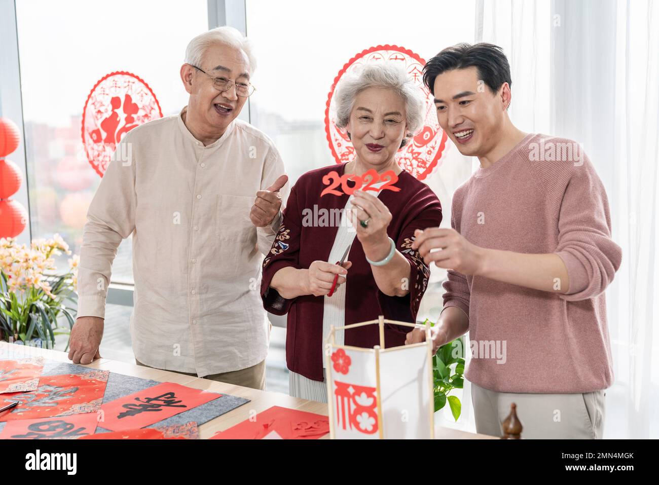 Happy three in paper cutting Stock Photo - Alamy