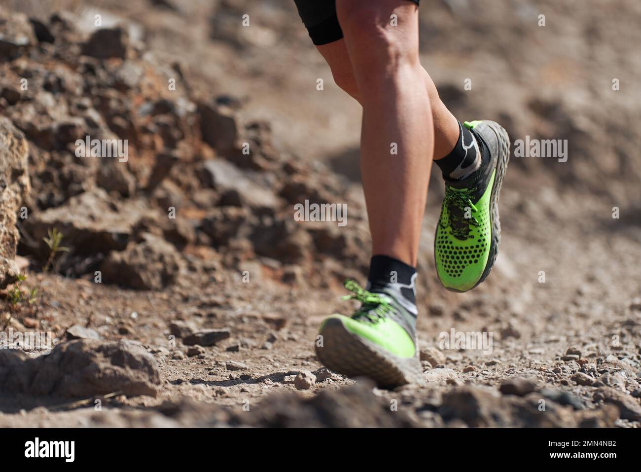 Trail running action close up of running shoes in action Stock Photo ...