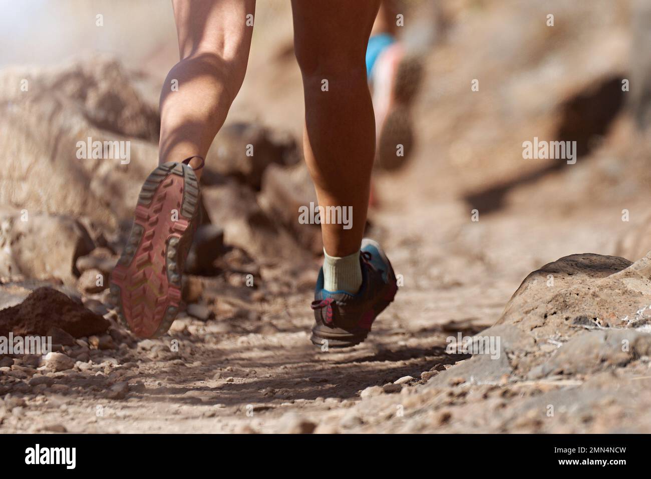 Trail running action close up of running shoes in action Stock Photo ...