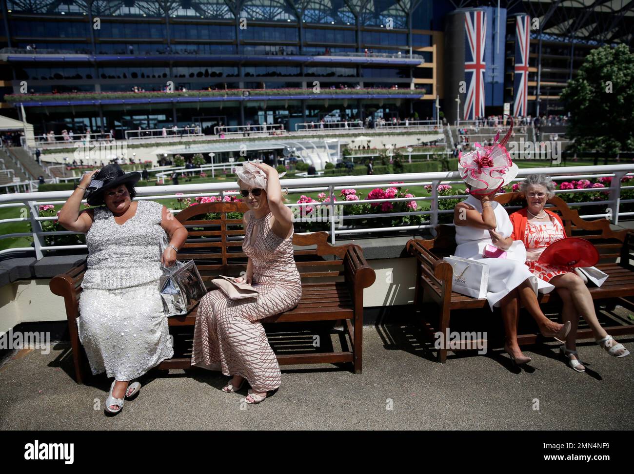 Racegoers attend the third day of the Royal Ascot horse race meeting ...