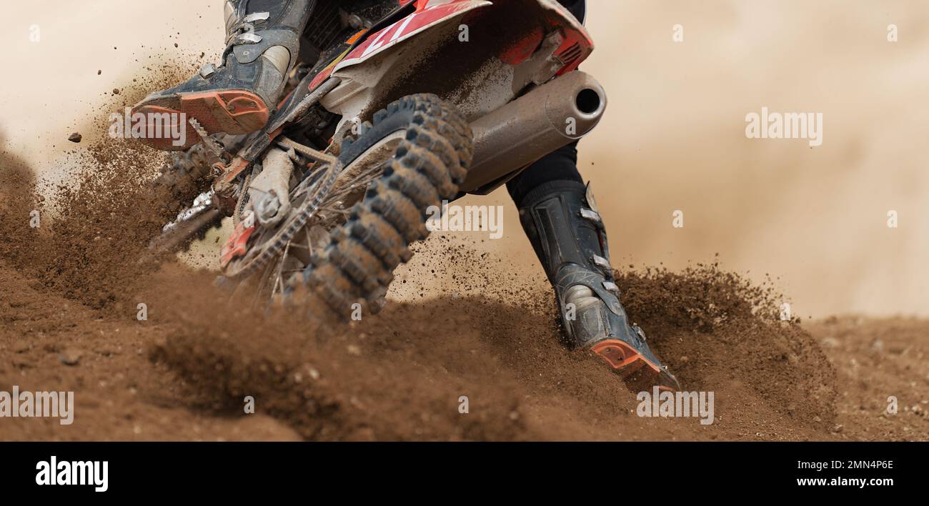 Rider driving in the motocross race the rear wheel motocross bike Stock ...