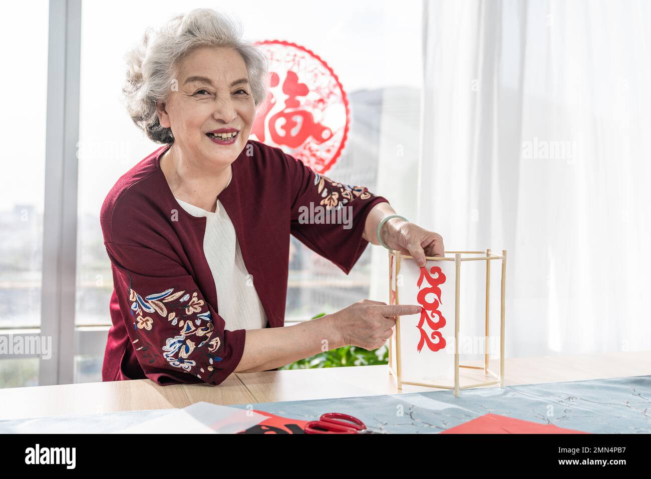 Elderly women in paper cutting Stock Photo - Alamy