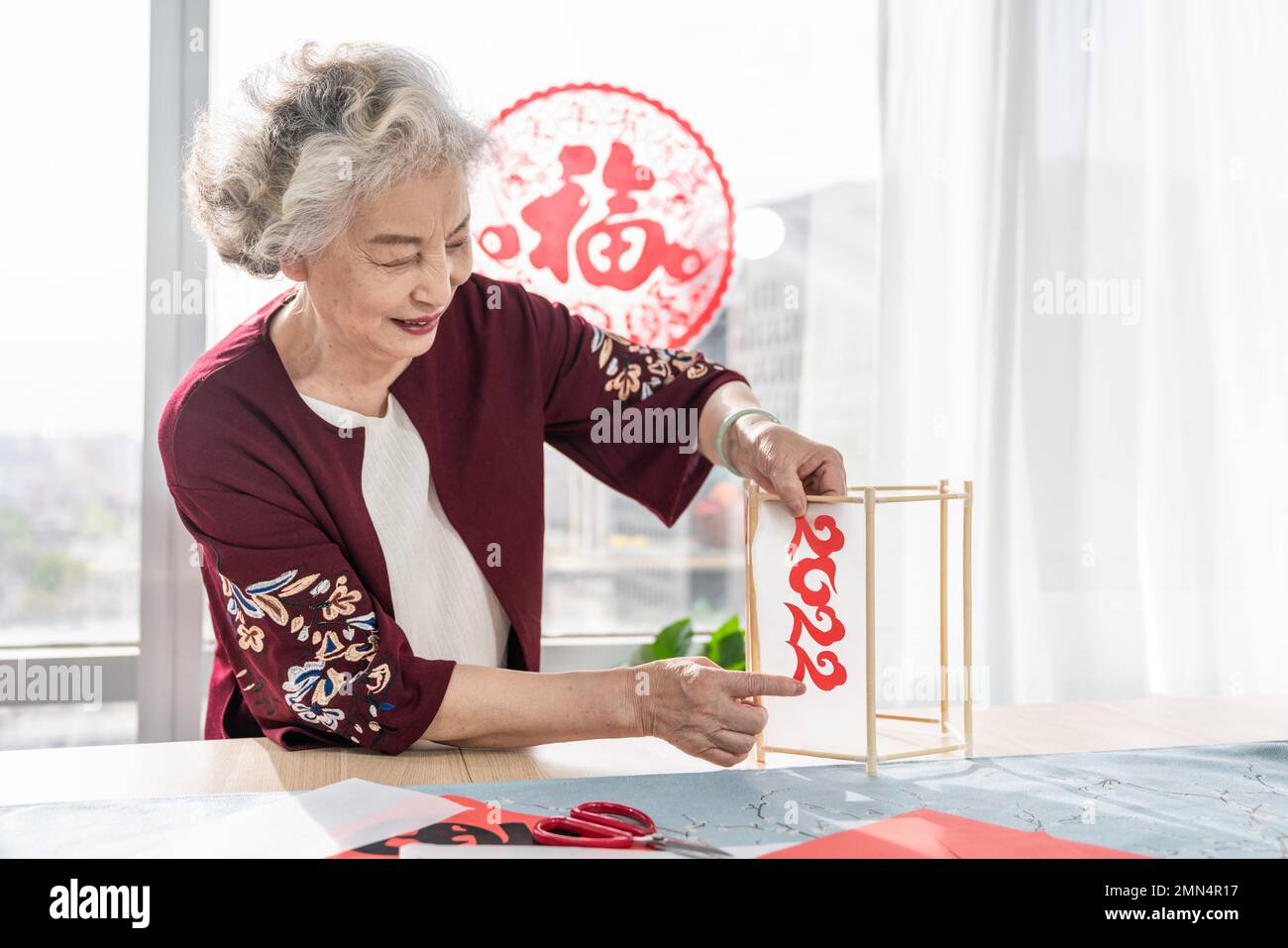 Elderly women in paper cutting Stock Photo - Alamy