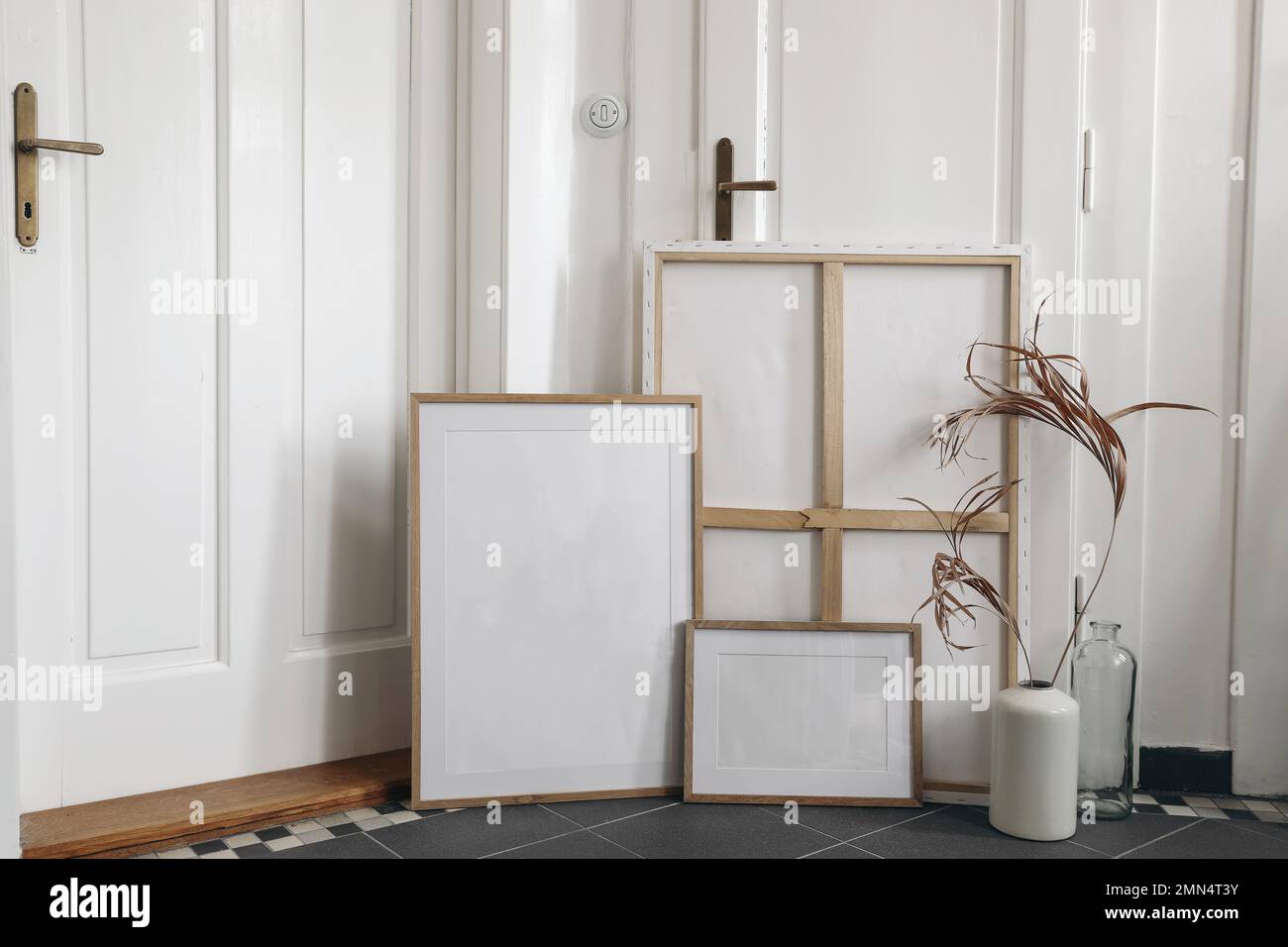 Boho wooden picture frames set and blank canvas mockups on grey tiles ...