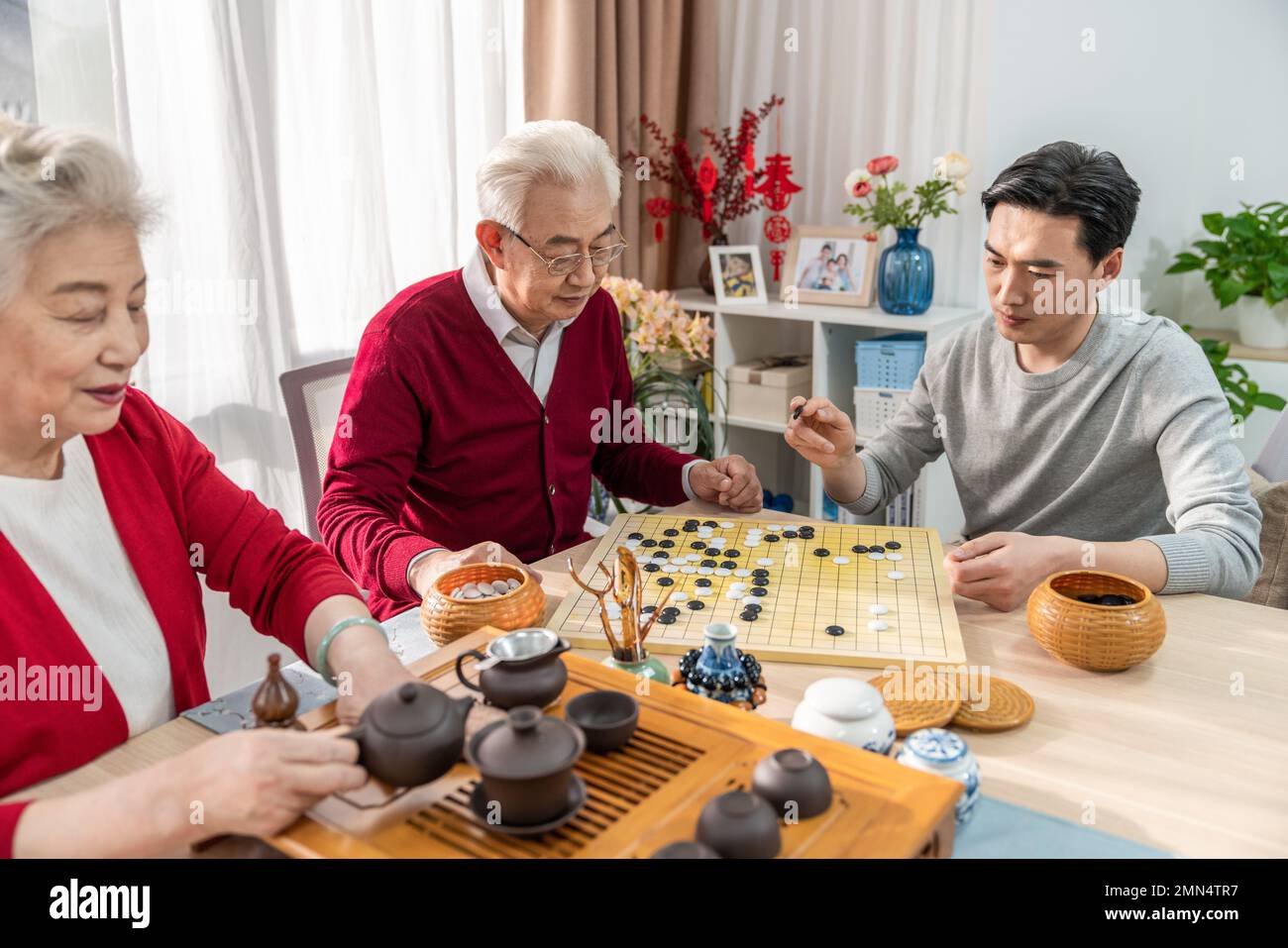 Happy family go over a cup of tea Stock Photo - Alamy