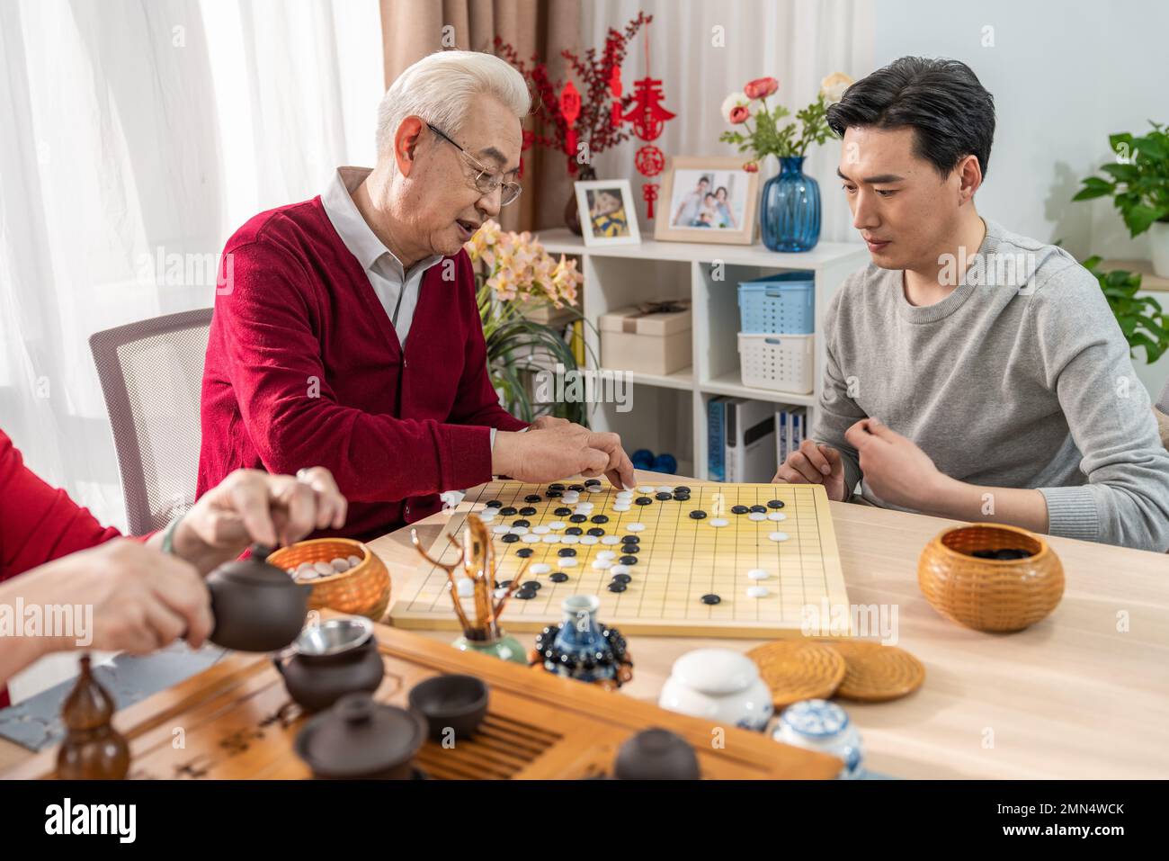 Happy family go over a cup of tea Stock Photo - Alamy