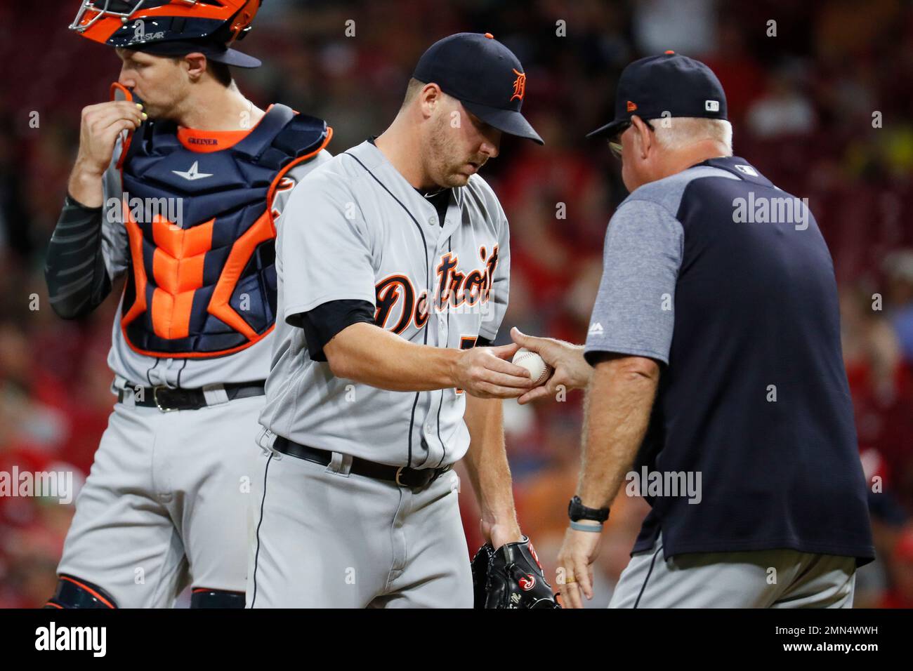 Detroit Tigers relief pitcher Warwick Saupold, center, is relieved by ...