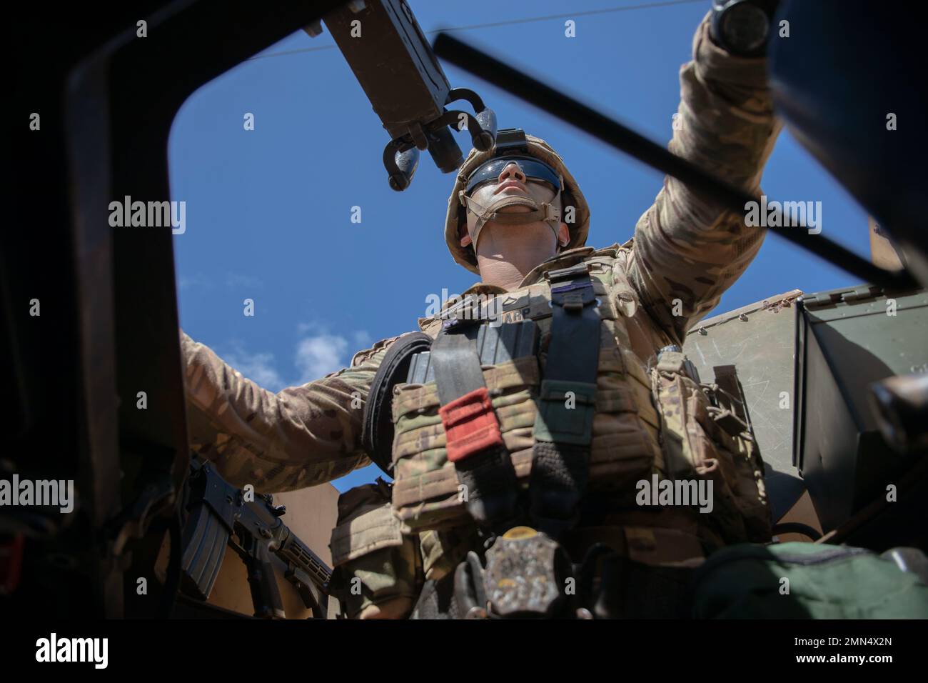 U.S. Army Pfc. Andrew Tharp, a gunner with 58th Military Police Company ...