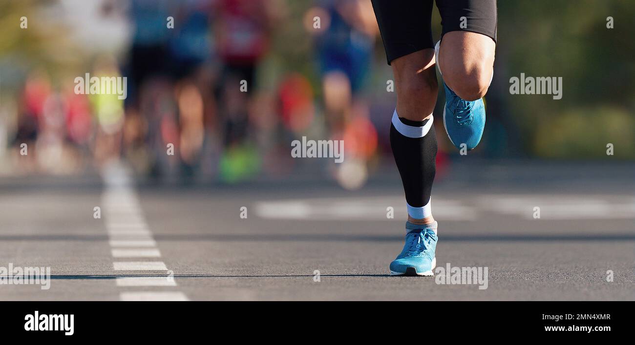 Marathon running race, people feet on city road Stock Photo - Alamy