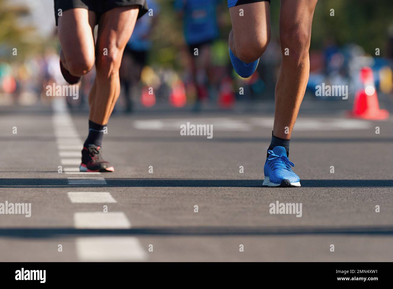 Marathon running race, people feet on city road Stock Photo - Alamy