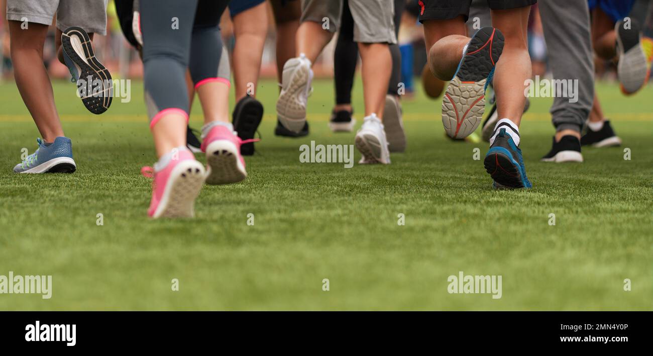 Running children, young athletes run in a kids run race, running on ...