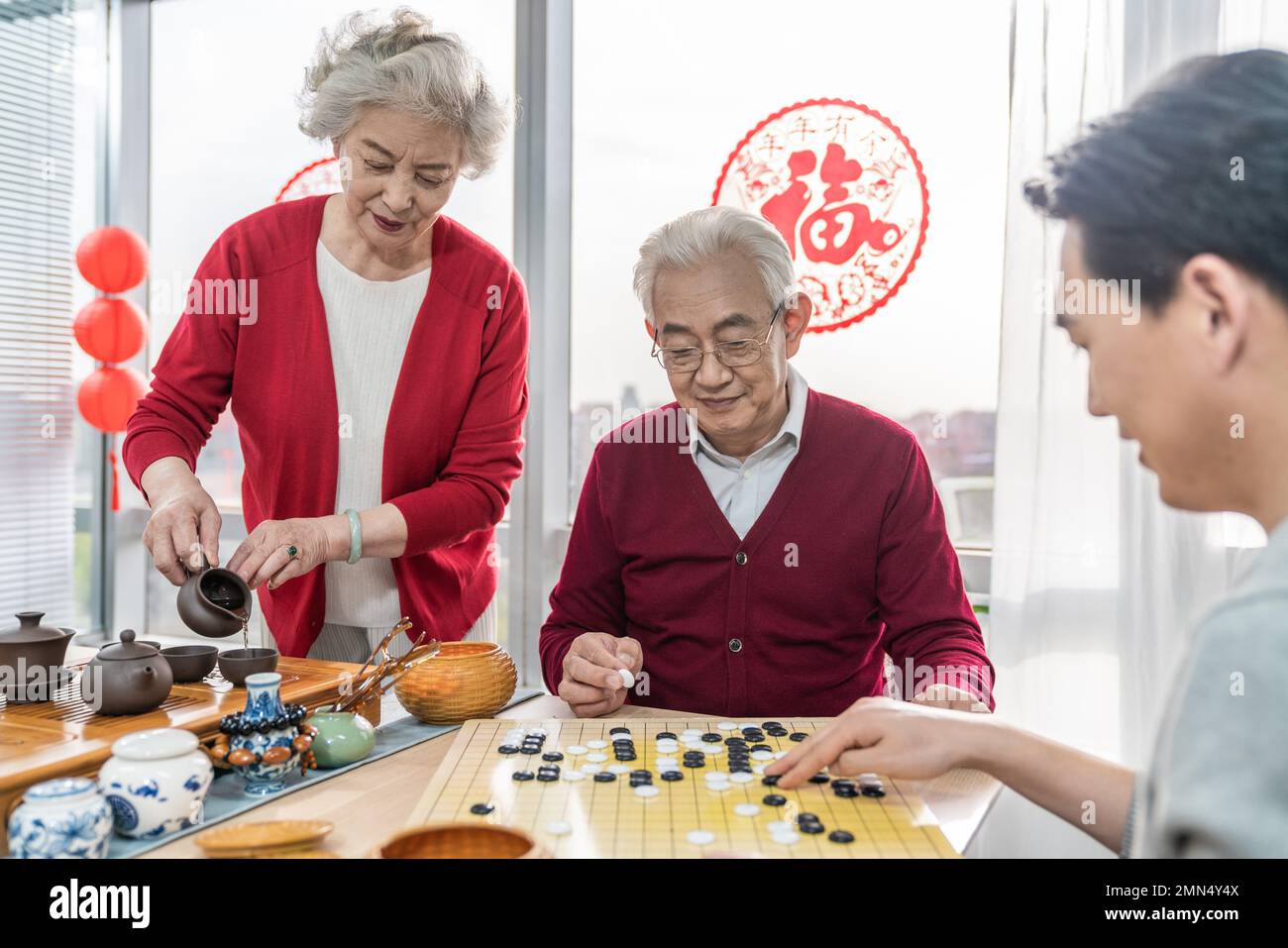 Happy family go over a cup of tea Stock Photo - Alamy