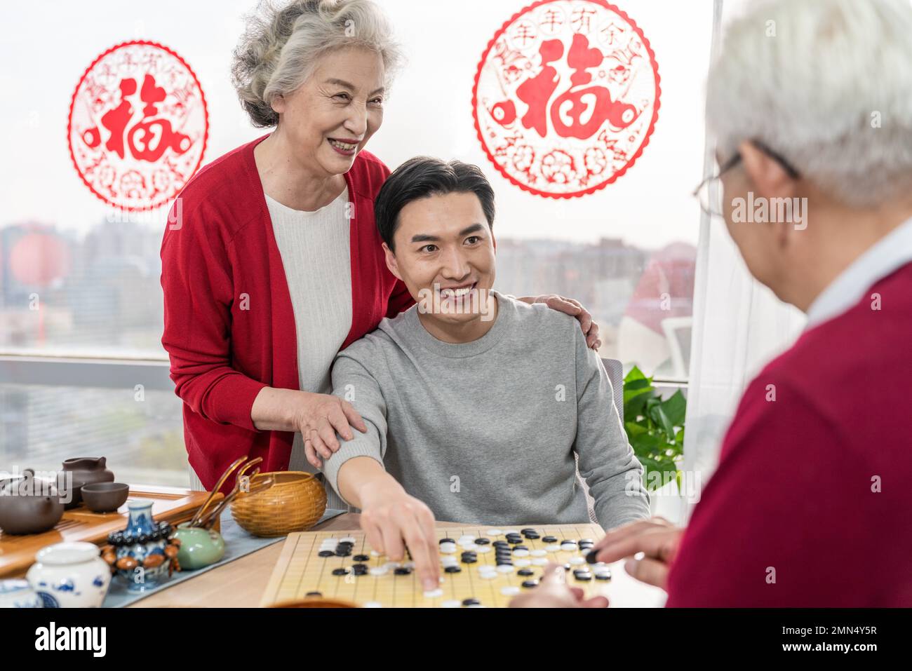 Happy family go over a cup of tea Stock Photo - Alamy