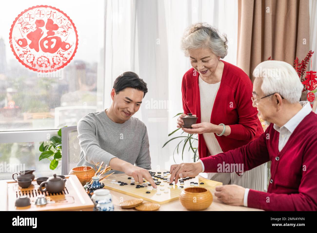 Happy family go over a cup of tea Stock Photo - Alamy