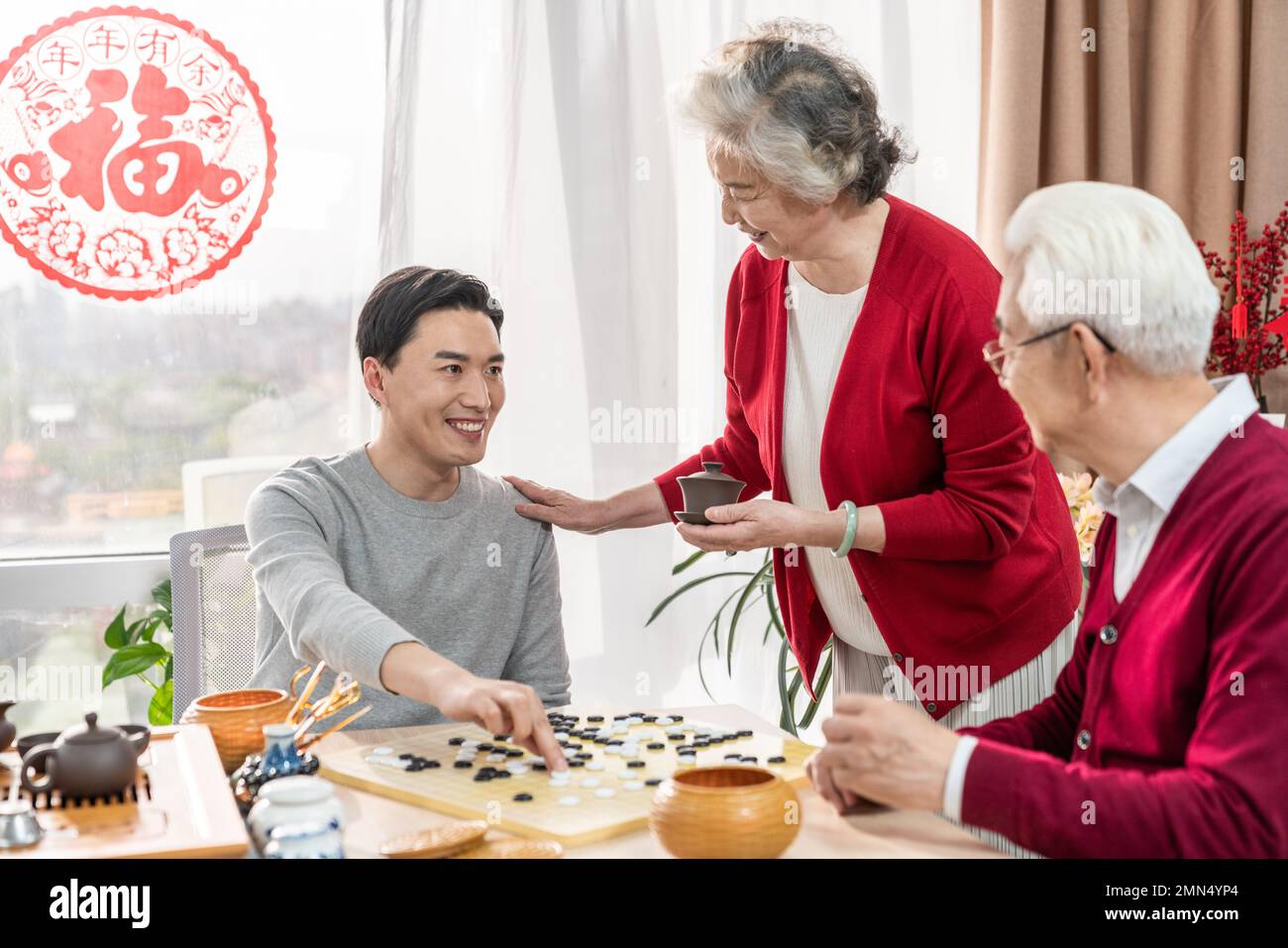 Happy family go over a cup of tea Stock Photo - Alamy