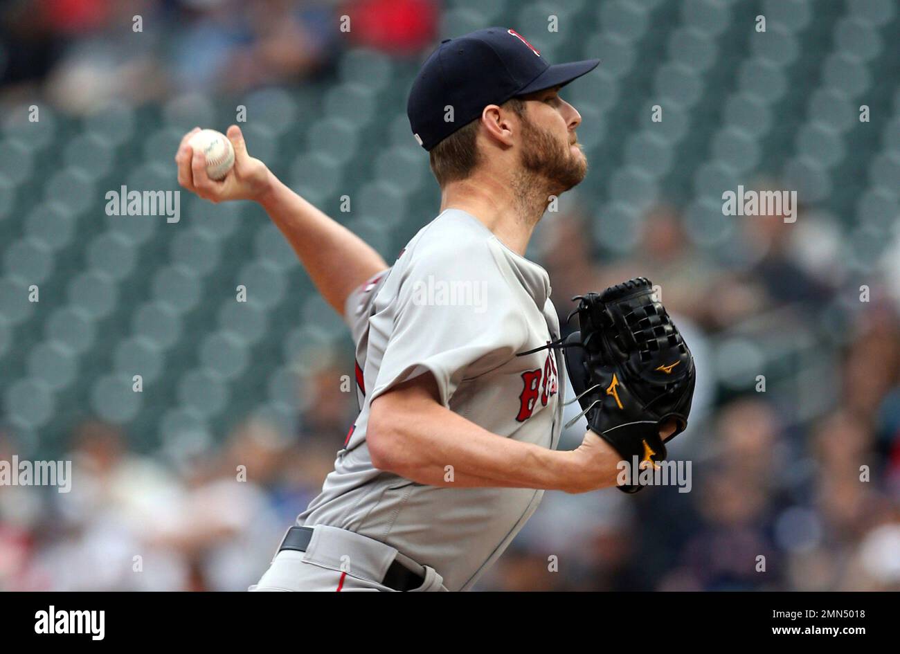 Boston Red Sox pitcher Chris Sale throws to a Minnesota Twins batter ...