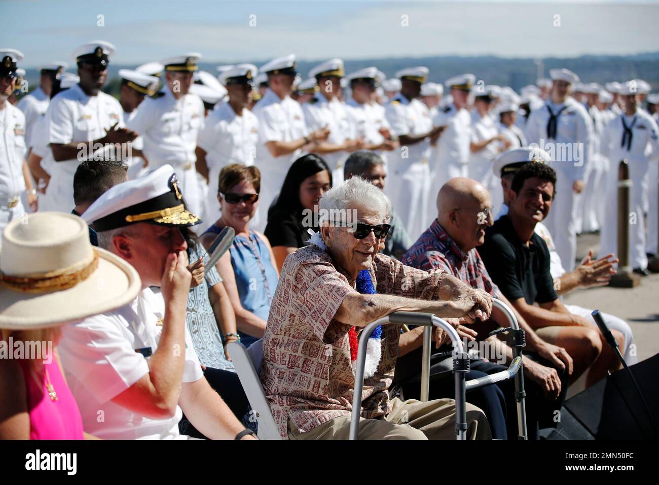 Pearl Harbor survivor Ray Emory, center, sits a surprise ceremony ...