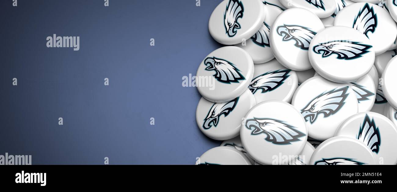 Logos of the American Football Team Philadelphia Eagles on a heap on a ...