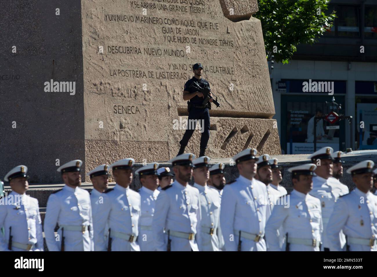 An armed police officer stands guard during a military parade ceremony ...