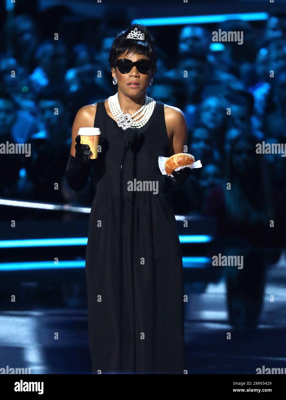 Host Tiffany Haddish, dressed up as Holly Golightly from "Breakfast at ...