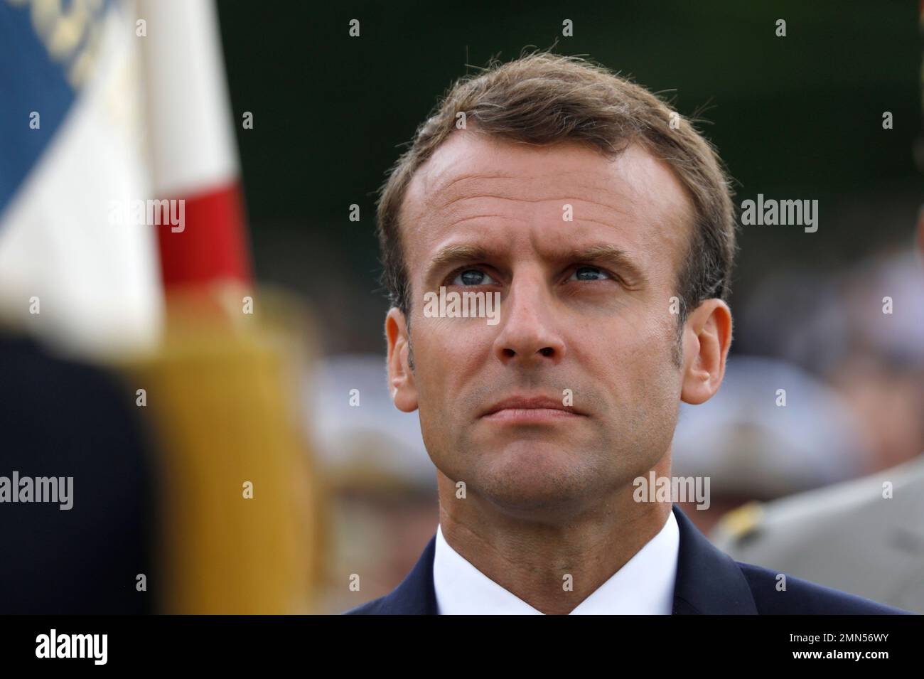 French President Emmanuel Macron pays attention during a WWII ceremony ...