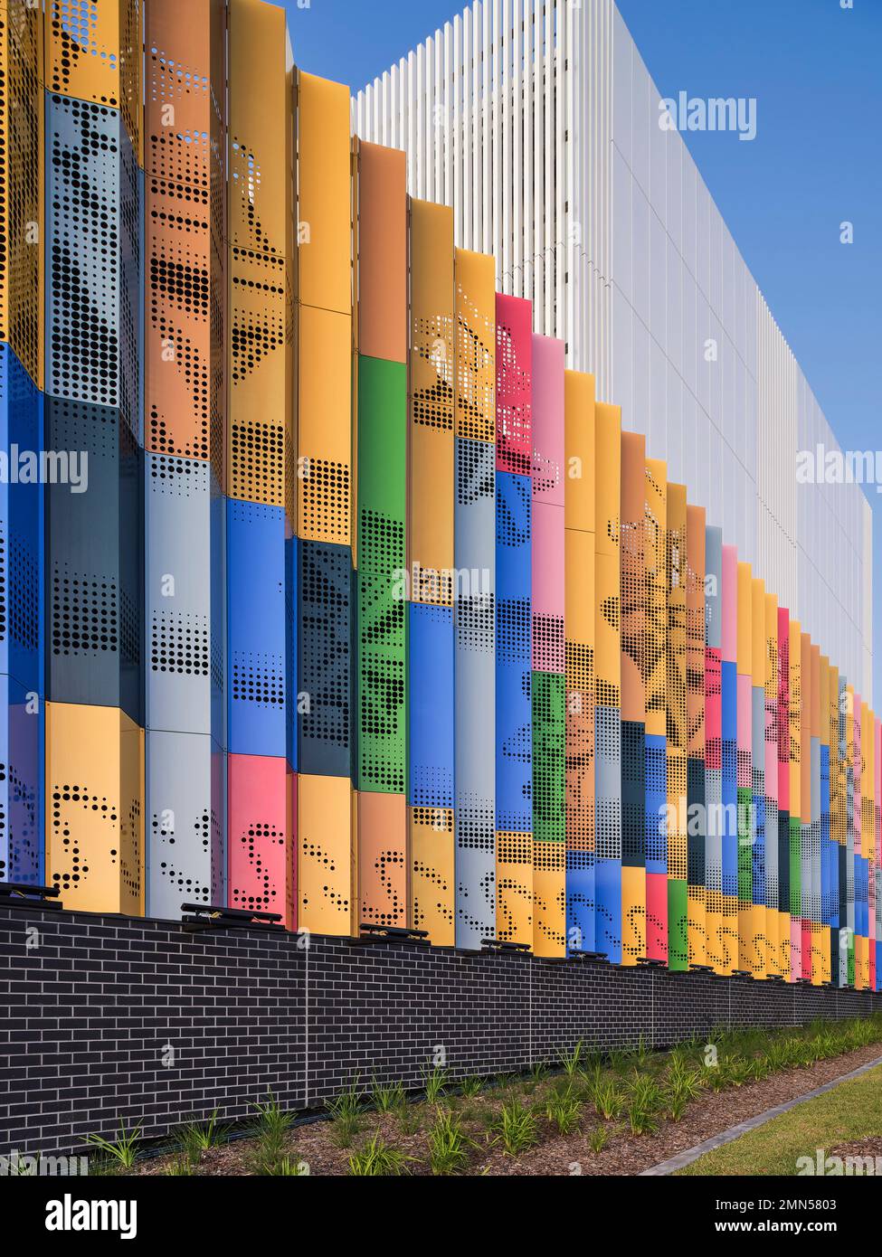 Facade detail featuring Aboriginal artwork with ventilation stacks ...