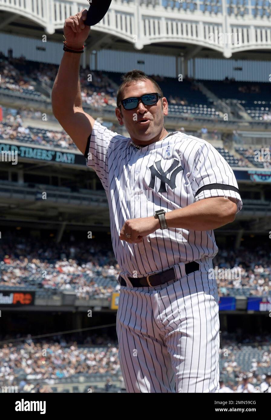 New York Yankees' Johnny Damon waves to the crowd as he is introduced ...