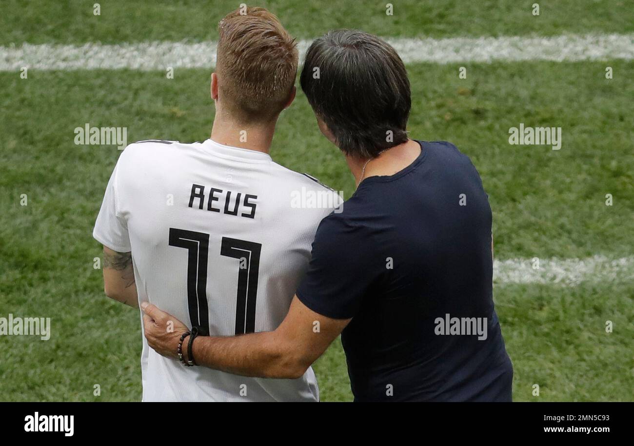 Germany's Marco Reus is briefed by Germany head coach Joachim Loew ...