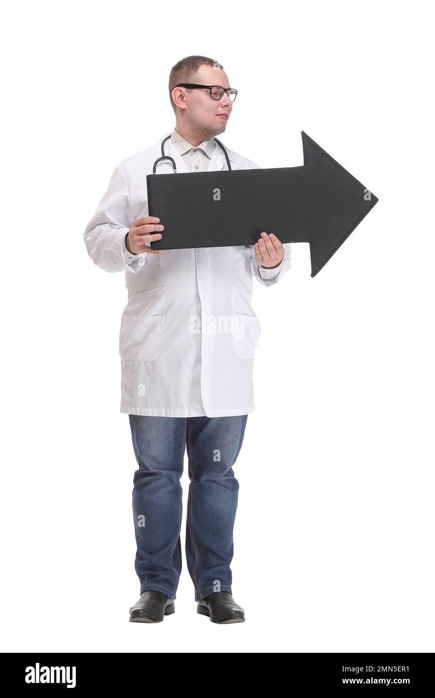 Front view of young smiling doctor holding a black arrow pointing right ...