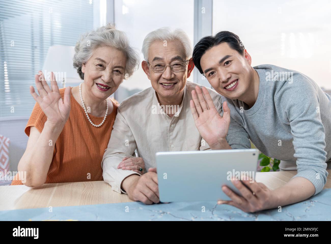 Happy family use tablet computers Stock Photo - Alamy