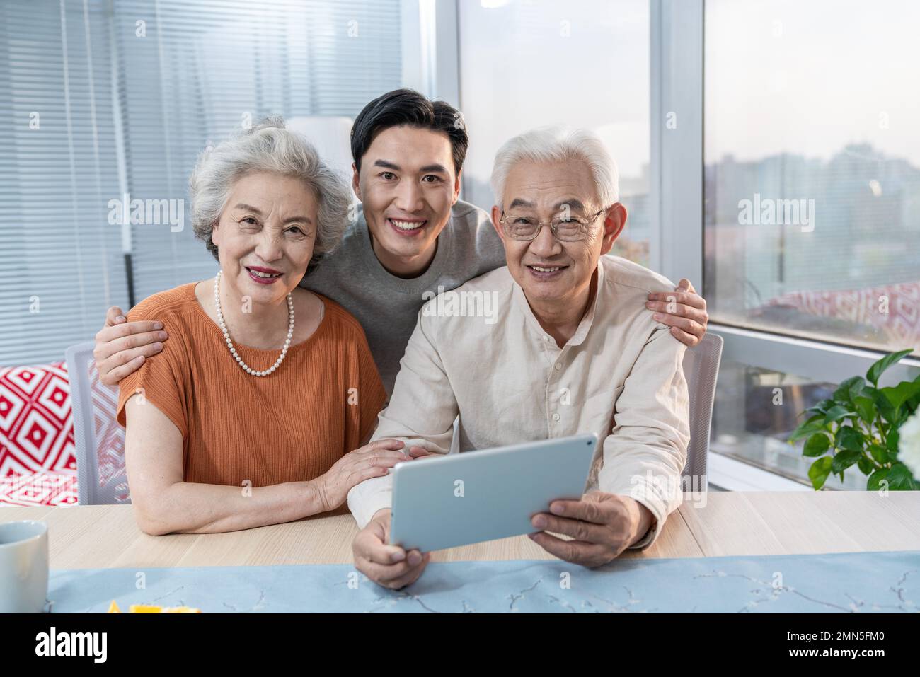 Happy family use tablet computers Stock Photo - Alamy